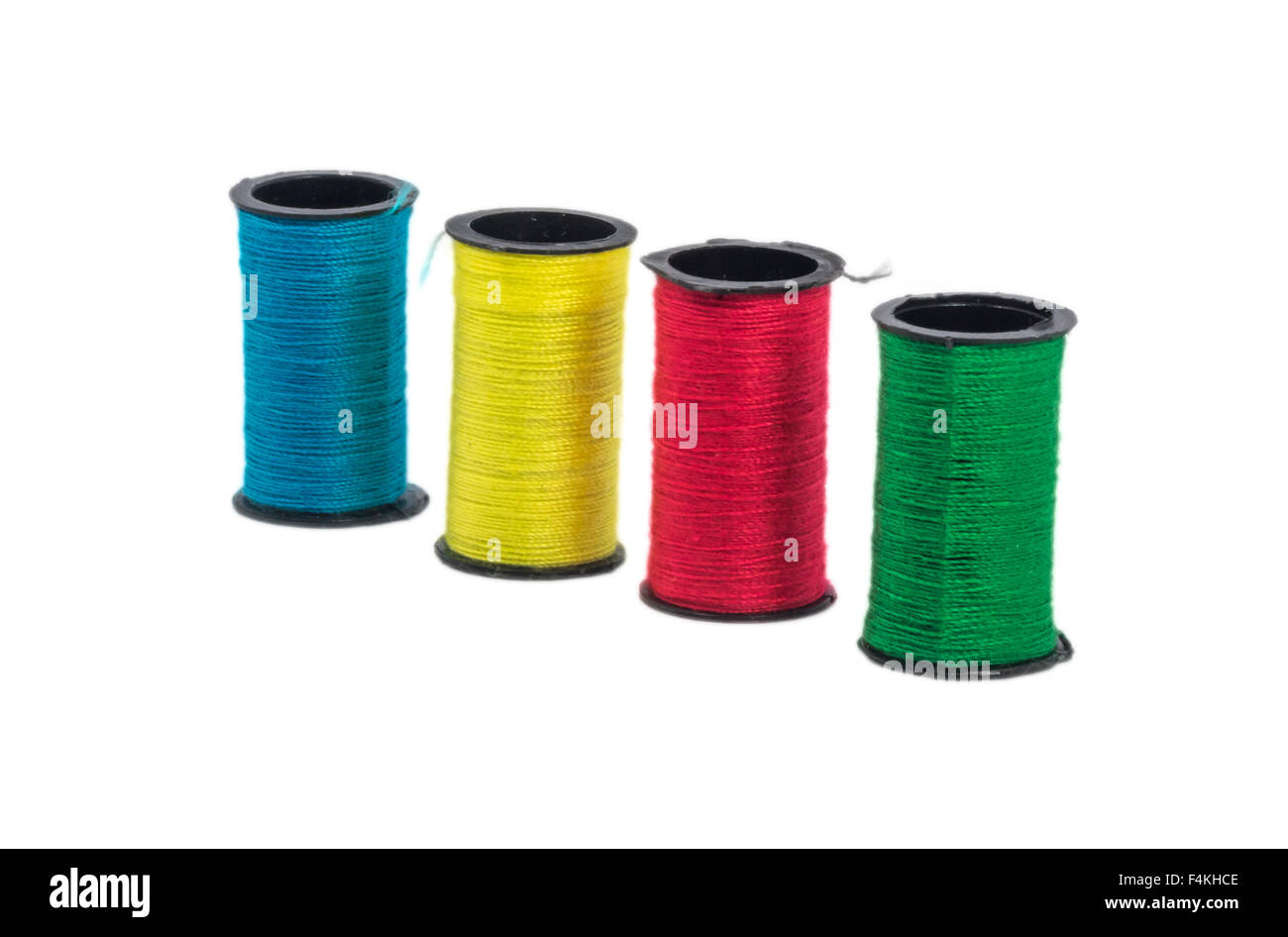 Multi color sewing thread with isolated white background Stock Photo ...