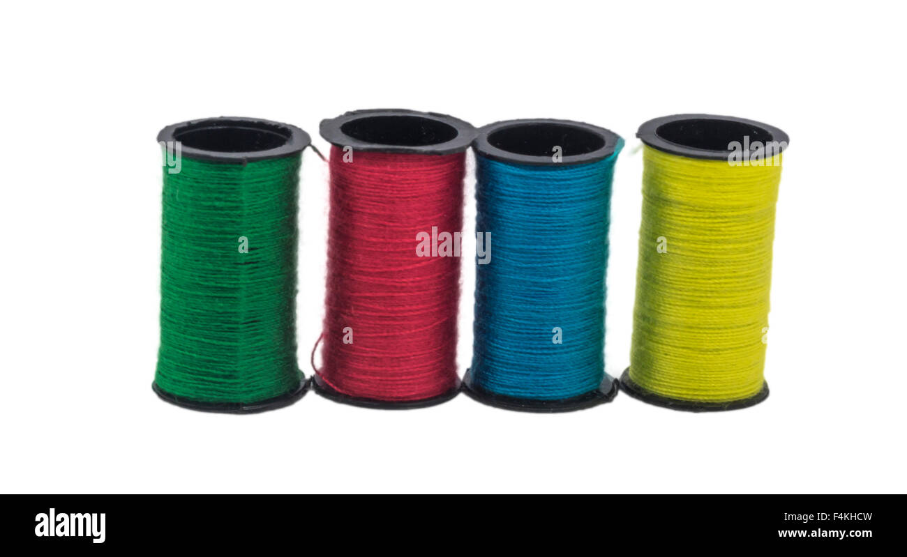 Multicolor sewing threads with isolated white background Stock Photo ...
