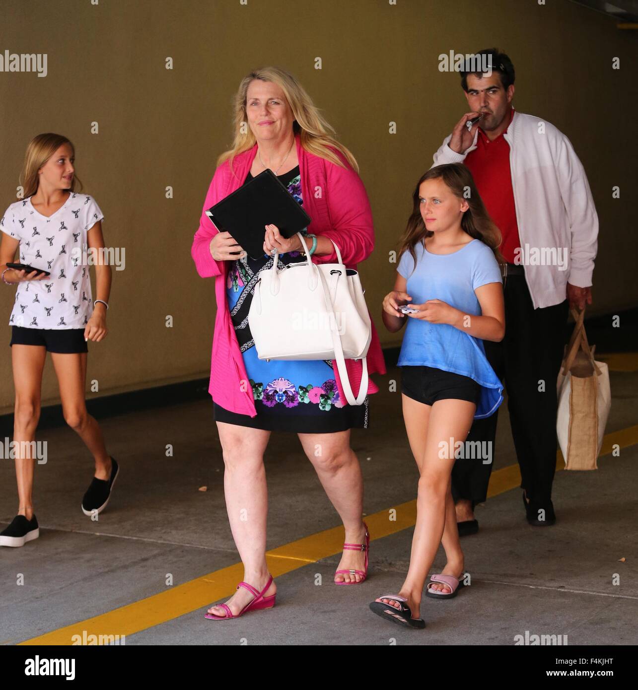 Jason Davis smokes an electronic cigarette while running errands in ...