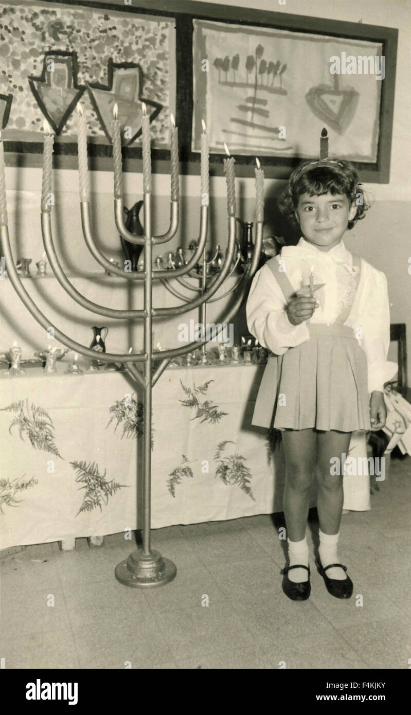 Girl with candelabra Stock Photo - Alamy