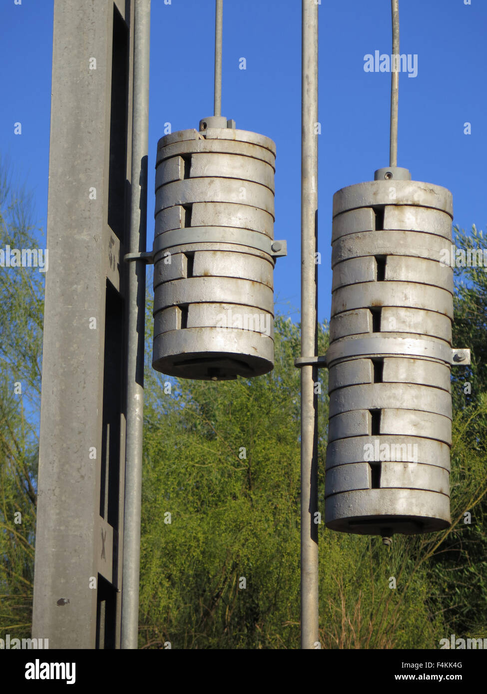 Railway overhead electric line counterweight blocks Stock Photo - Alamy