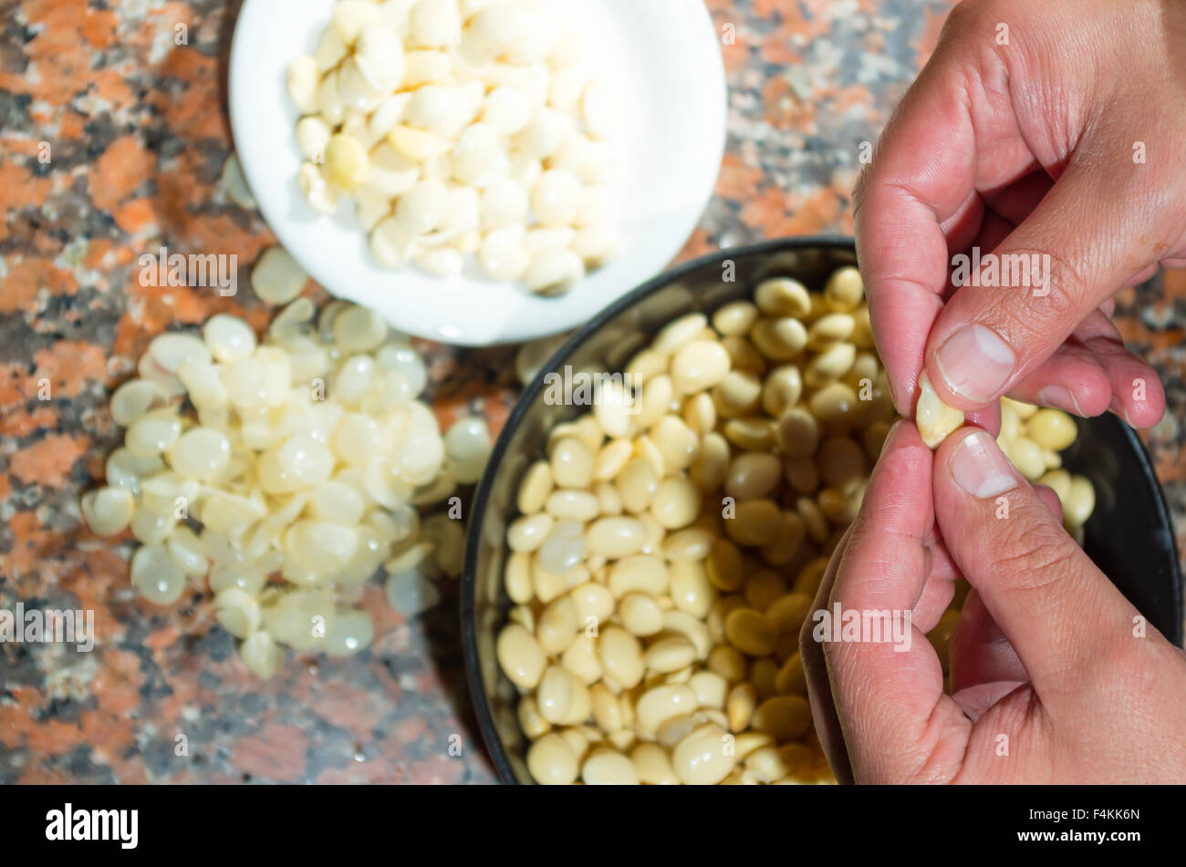 Closeup peeling, before and after bowls with lupini beans superfood ...
