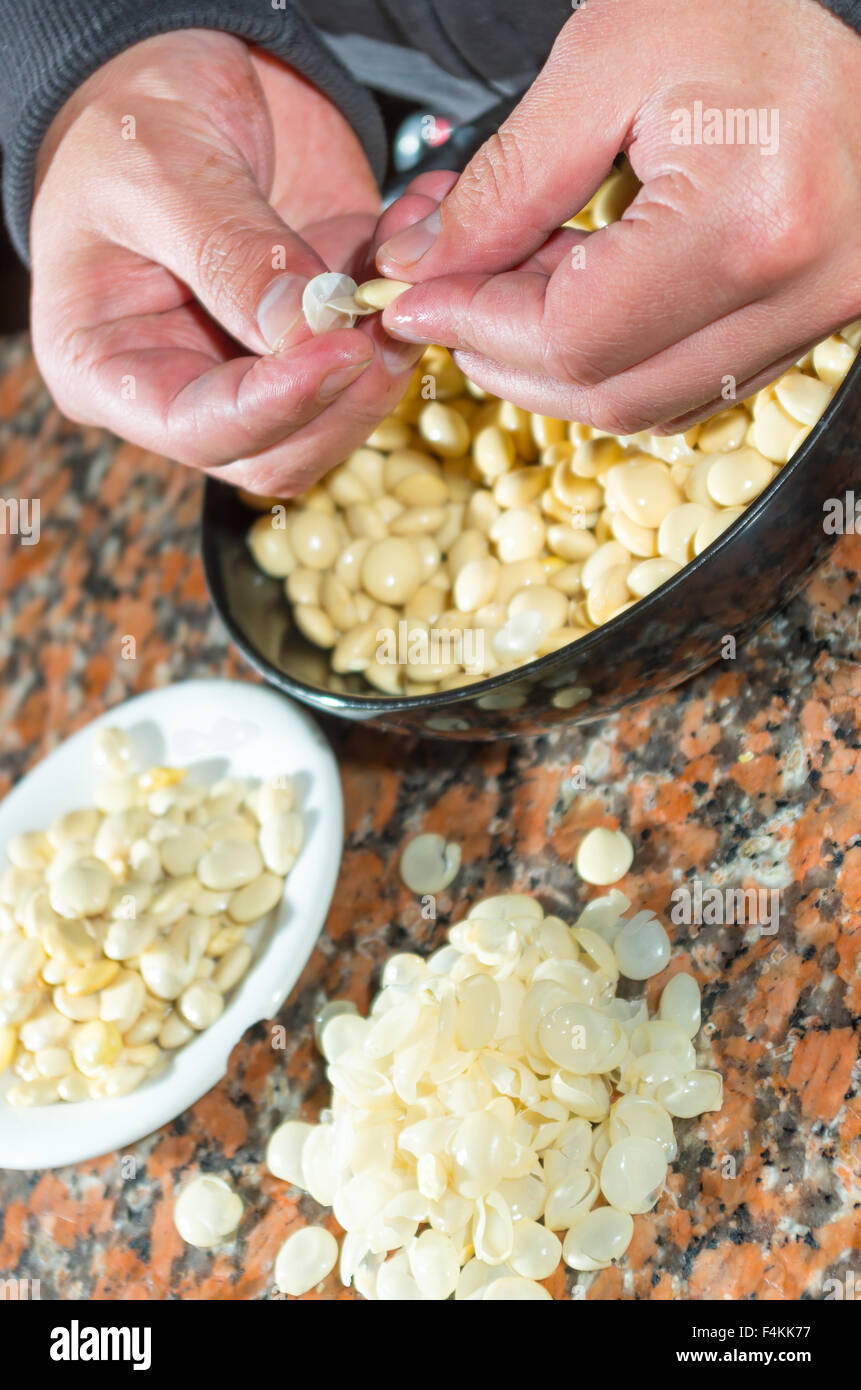 Closeup peeling, before and after bowls with lupini beans superfood ...