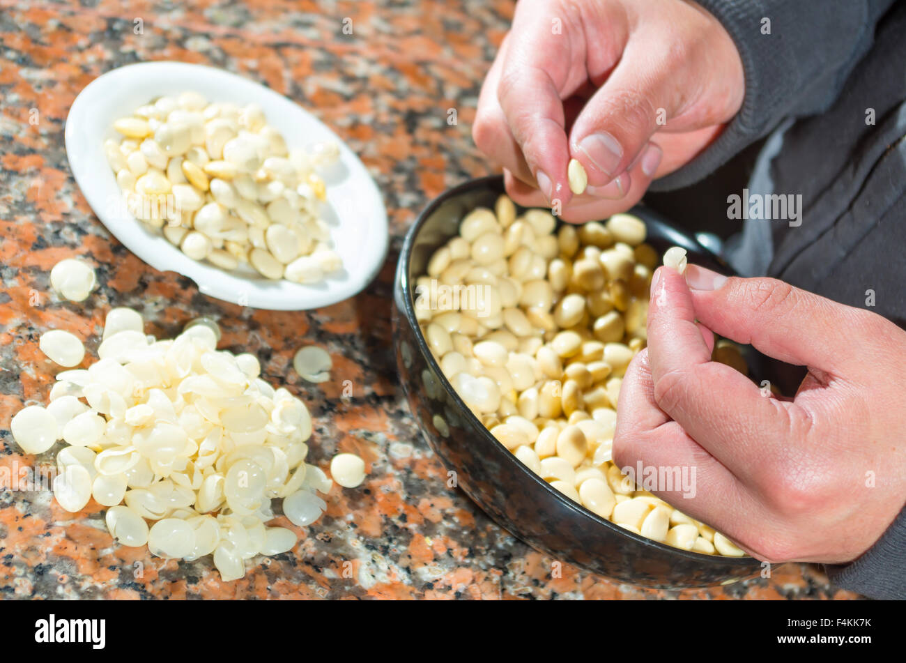 Closeup peeling, before and after bowls with lupini beans superfood ...