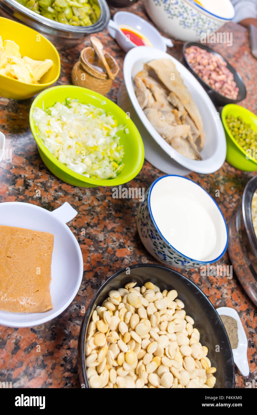 Bowls of different ingredients spread out on granite surface including ...