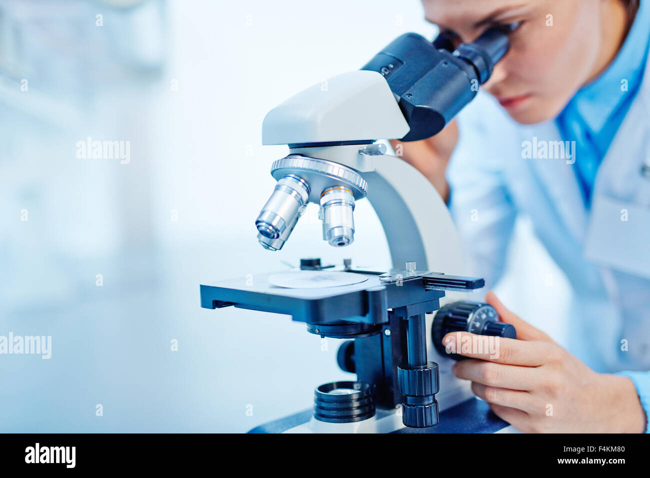 Young female chemist studying new substance in lab Stock Photo - Alamy