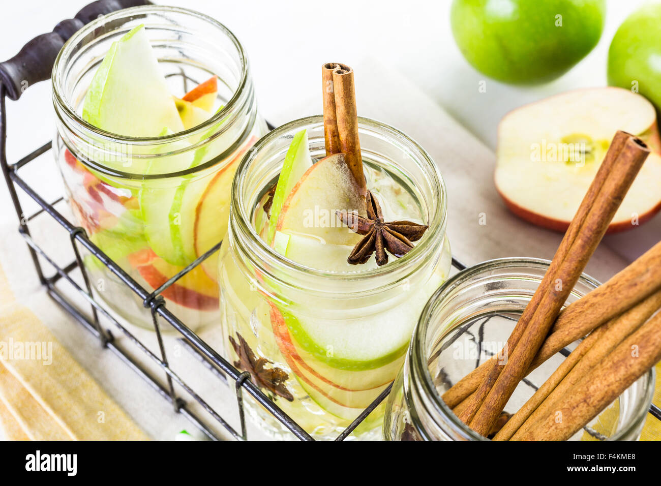 Infused apple water with cinnamon and anise Stock Photo - Alamy
