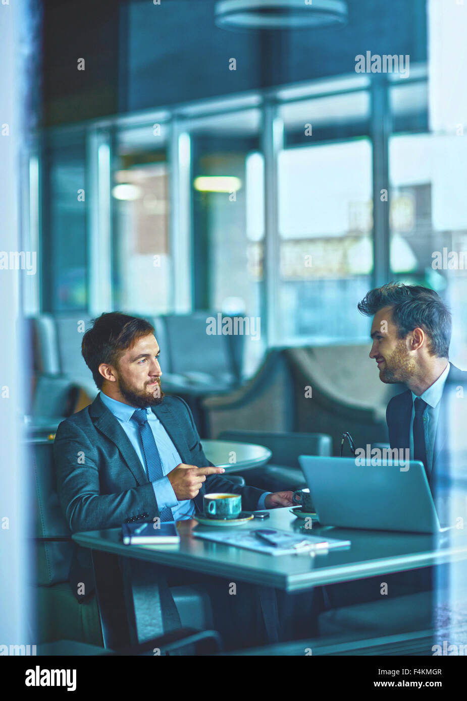 Two confident managers sharing ideas in cafe Stock Photo - Alamy
