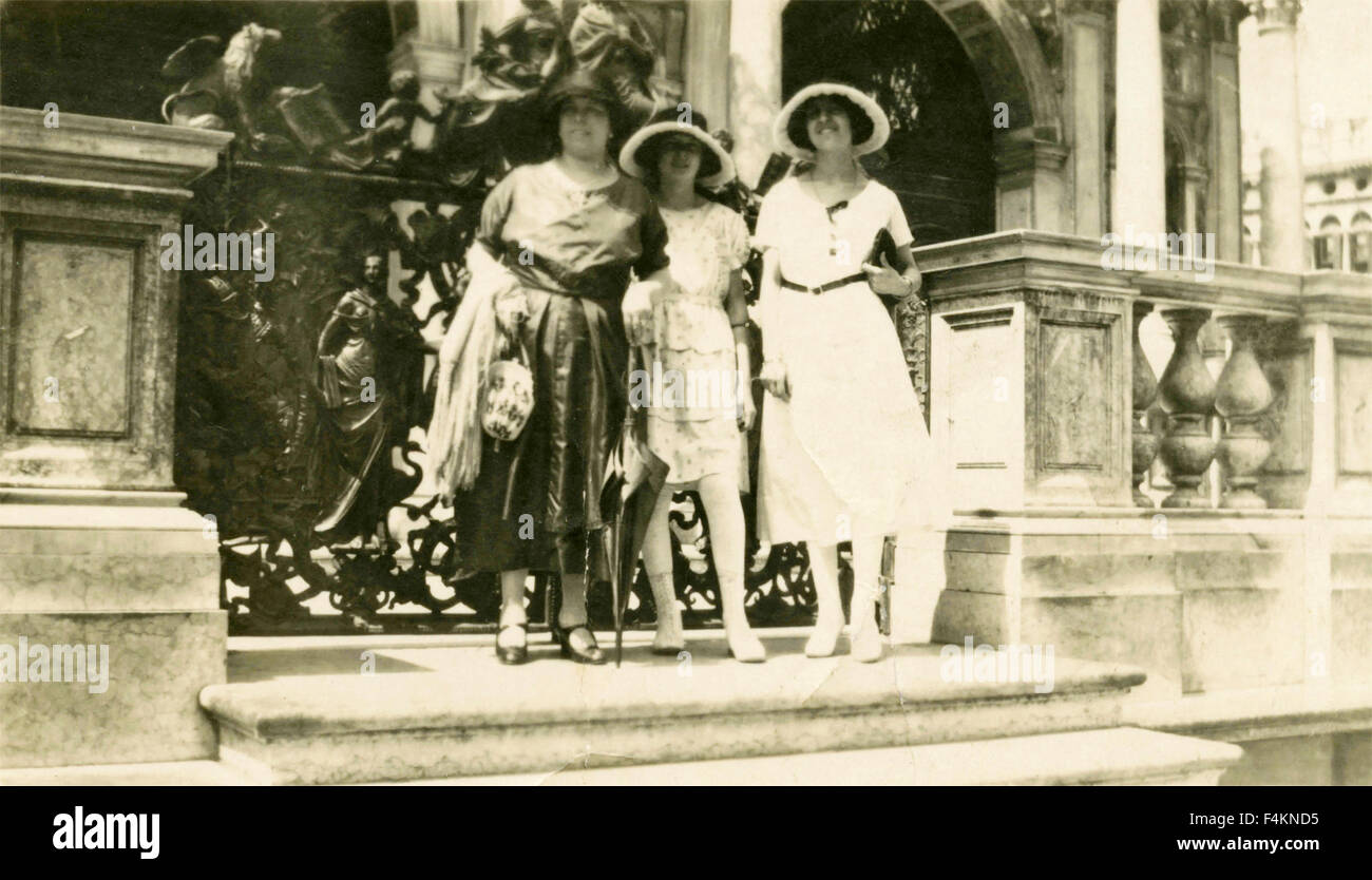 Three women in the courtyard of a church, Italy Stock Photo - Alamy