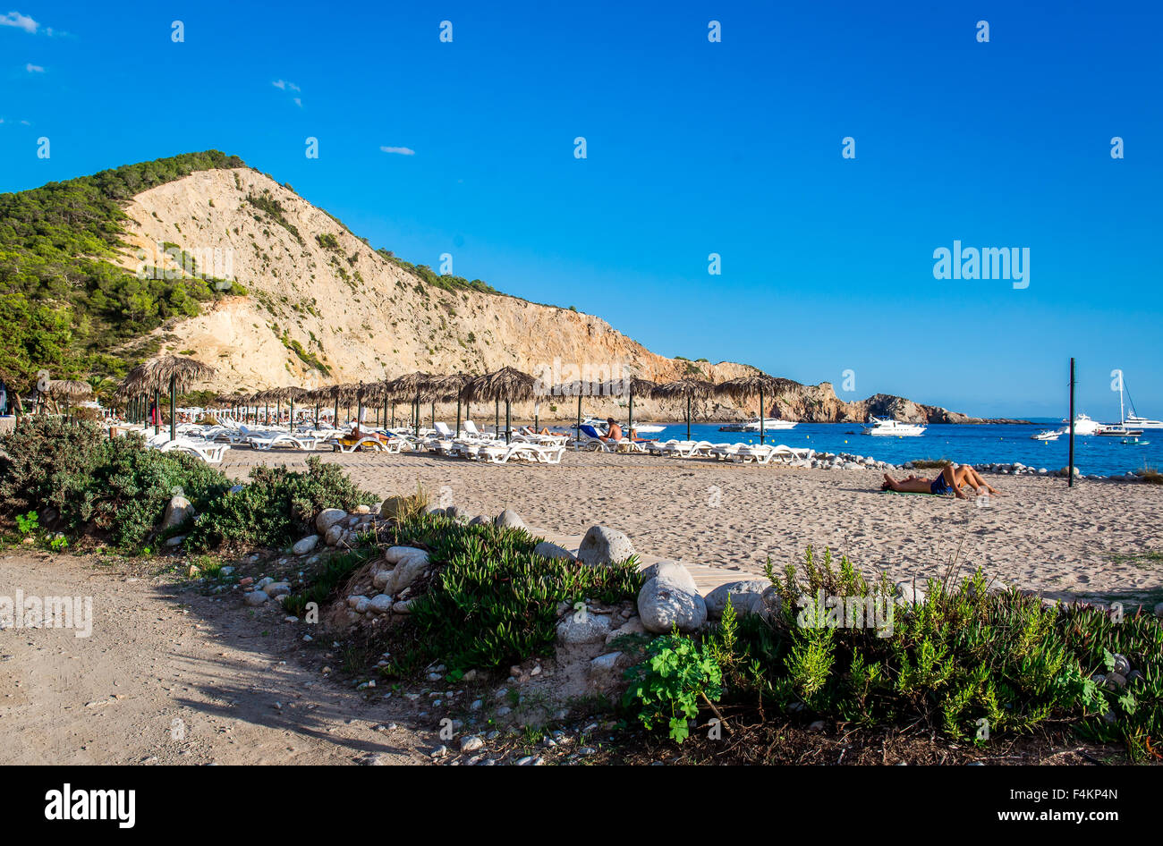 People sunbathing on the Ibiza beach Stock Photo - Alamy