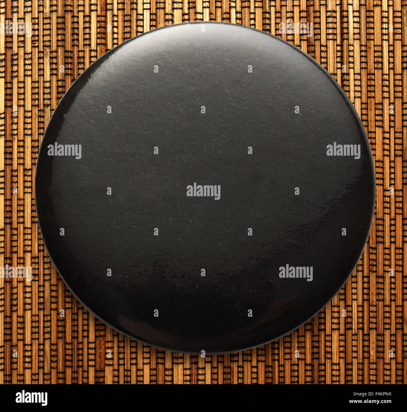 Blank black button as background in closeup Stock Photo - Alamy
