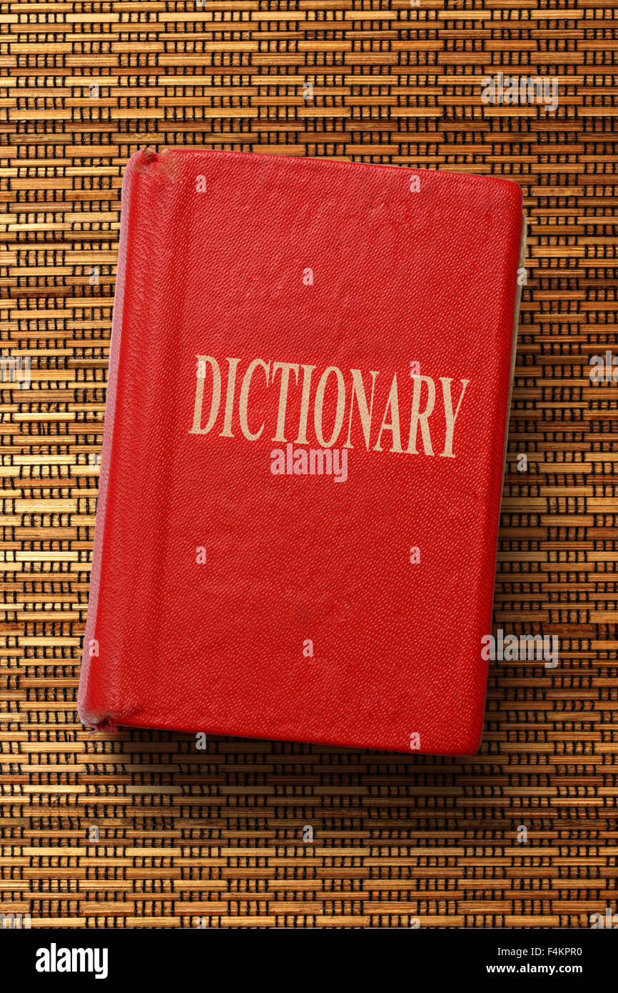 Old red dictionary on the textured background Stock Photo - Alamy
