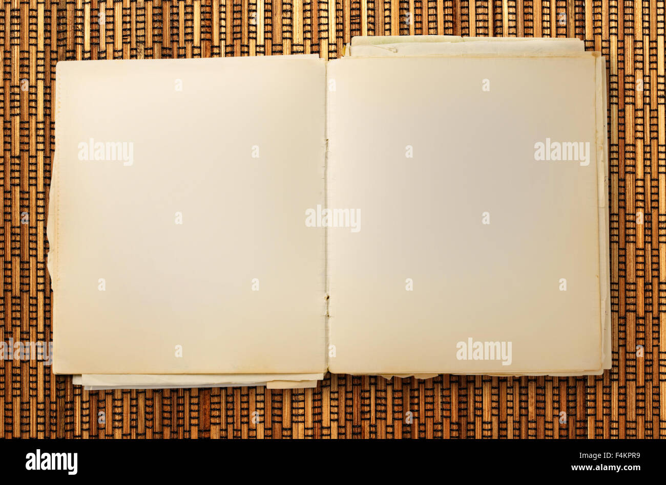 Old open notebook blank on tuxtured background Stock Photo - Alamy