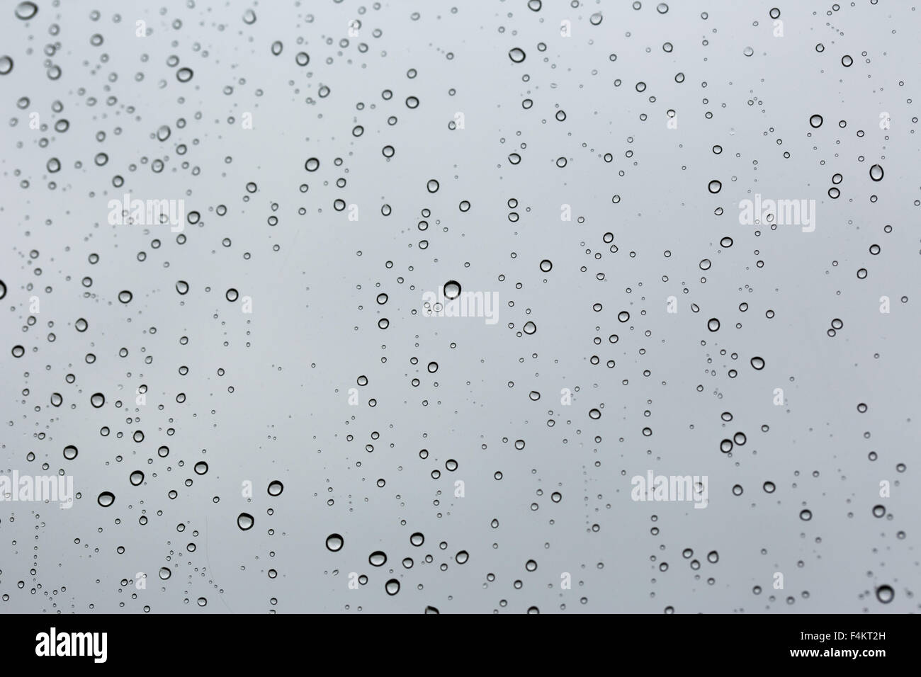 Cold rain drops on window as background Stock Photo - Alamy