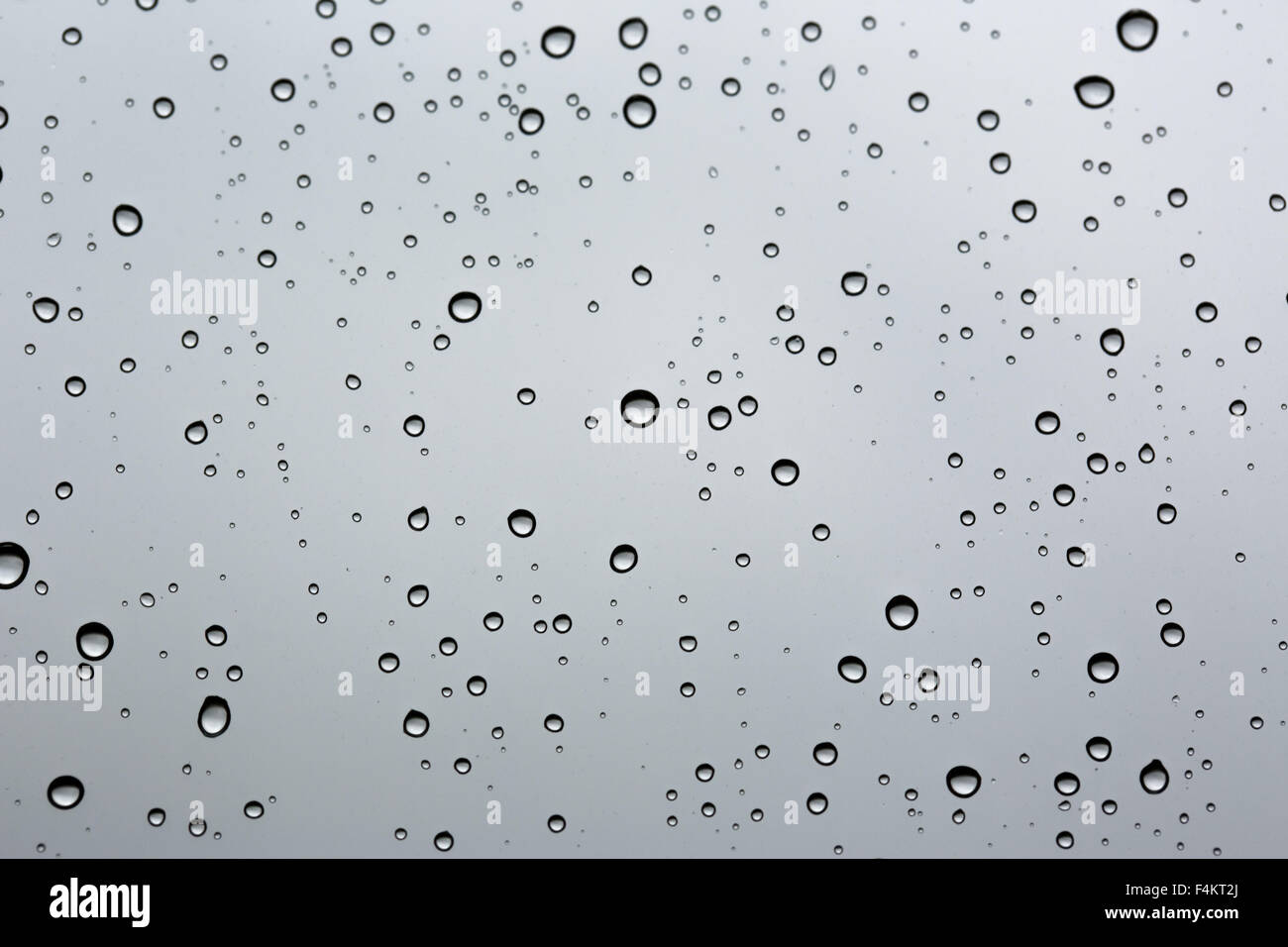 Cold rain drops on window as background Stock Photo - Alamy