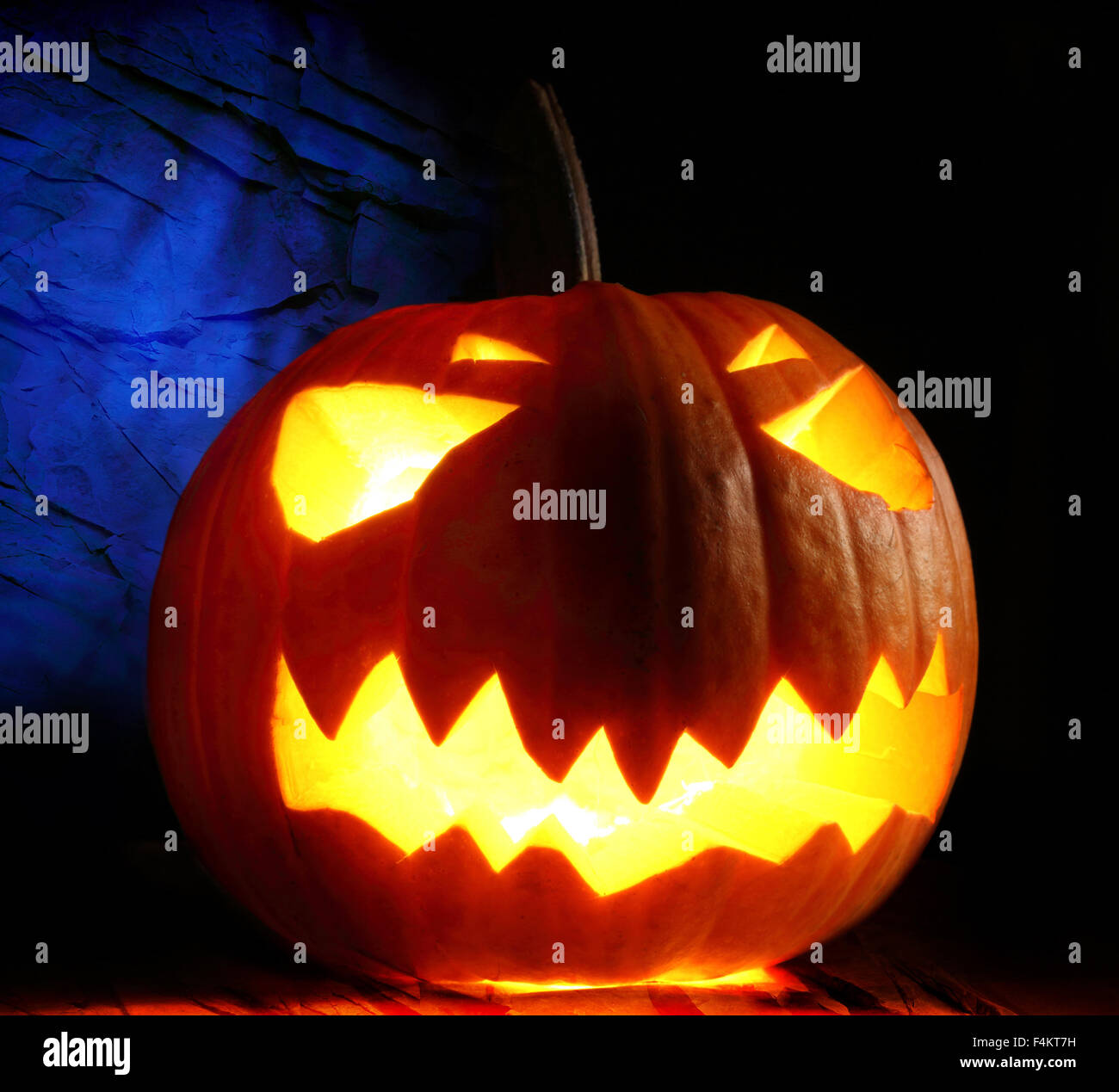 Angry halloween pumpkin in blue light Stock Photo - Alamy