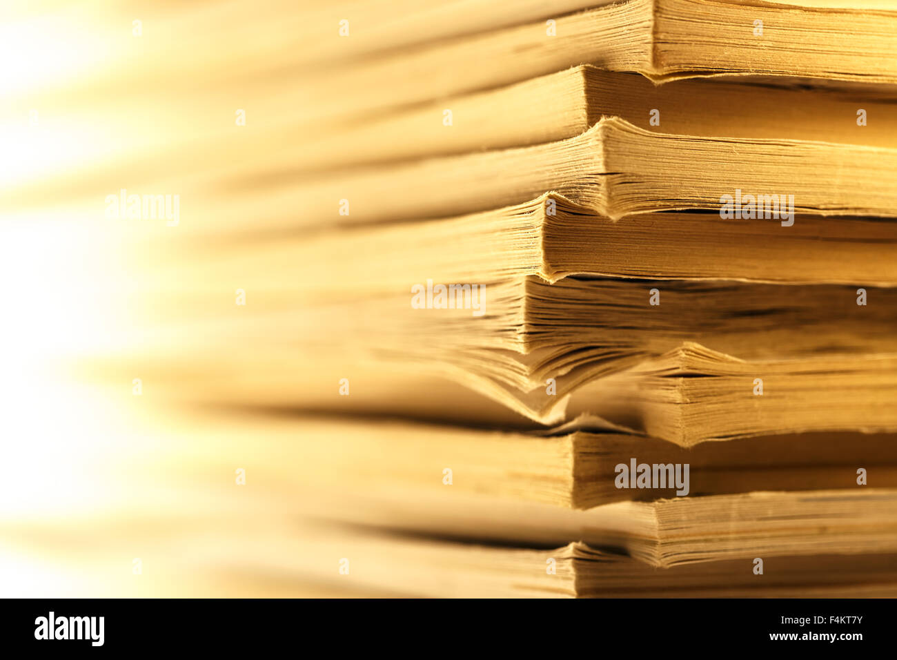 Stack of old magazines as background in toning Stock Photo - Alamy