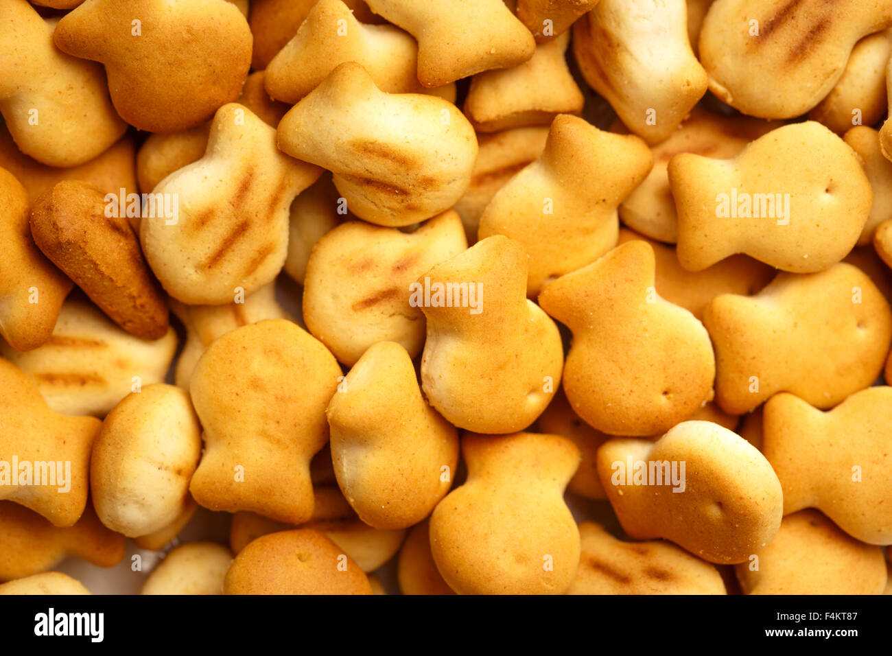 Salty crackers in shape of fish as background Stock Photo - Alamy