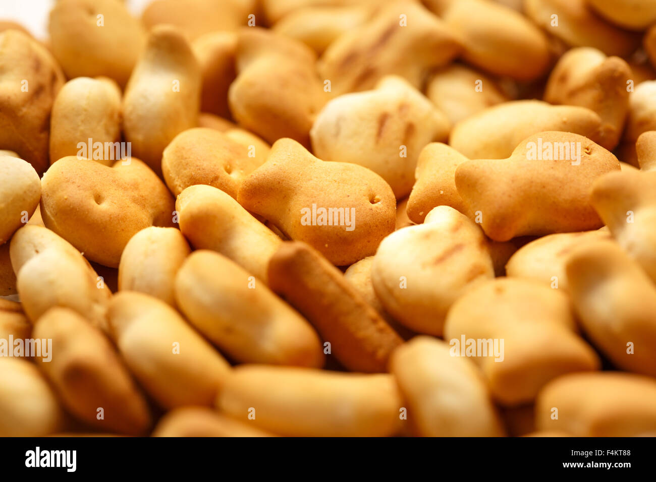Salty crackers in shape of fish as background Stock Photo - Alamy