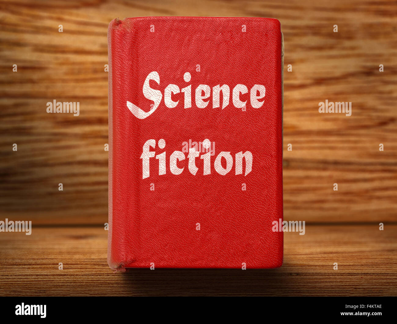 Old red science fiction book on wooden background closeup Stock Photo ...