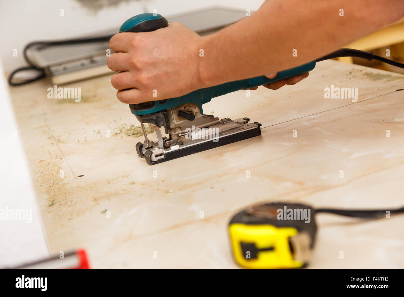 Installing new induction hob in modern kitchen Stock Photo - Alamy