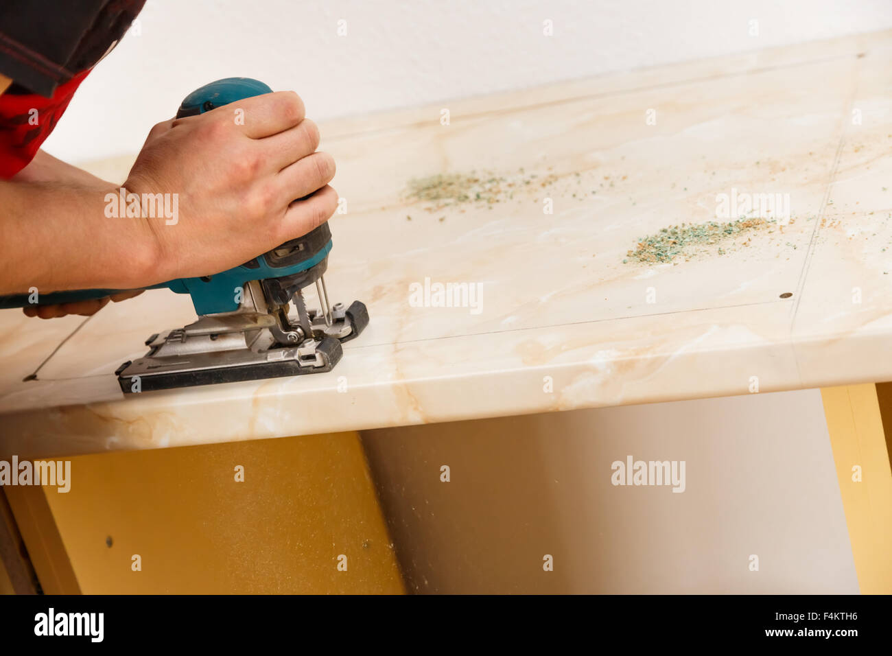 Installing new induction hob in modern kitchen Stock Photo - Alamy