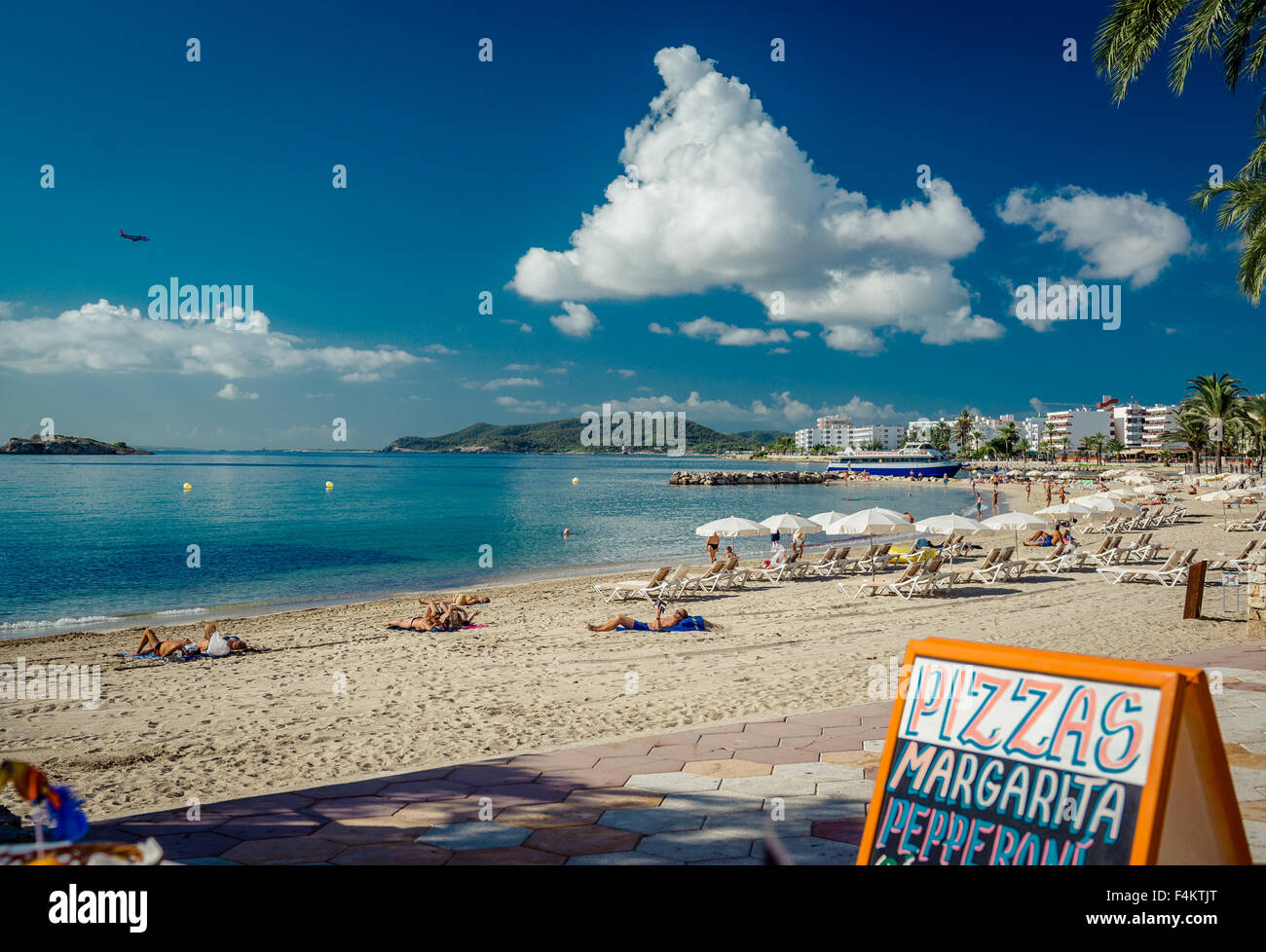 People sunbathing on a Ibiza coast Stock Photo - Alamy