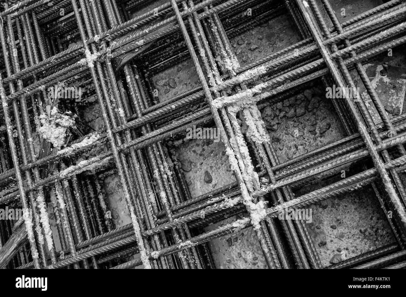 Splashes of concrete on pile of rebar Stock Photo - Alamy
