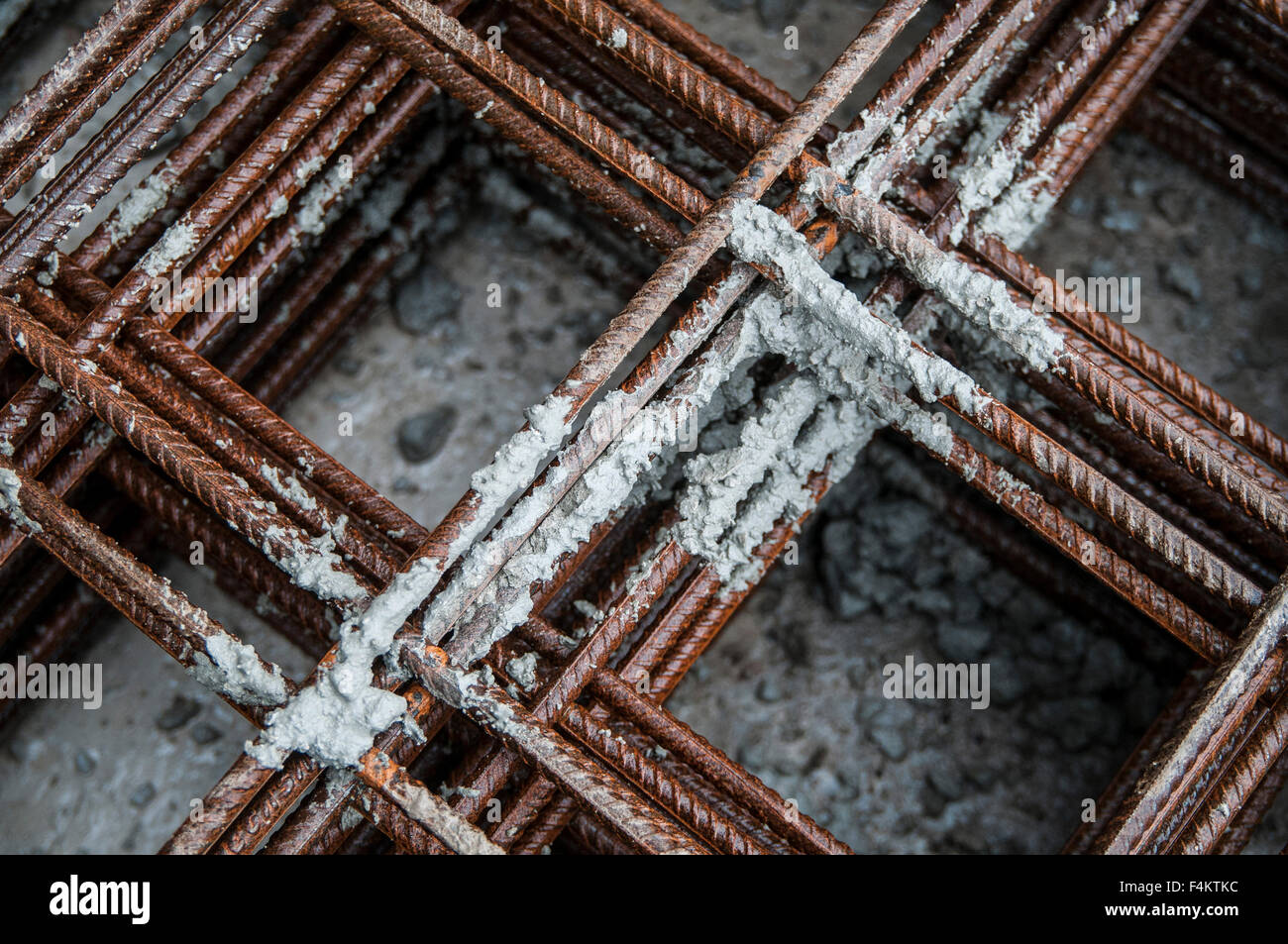 Splashes of concrete on pile of rebar Stock Photo - Alamy
