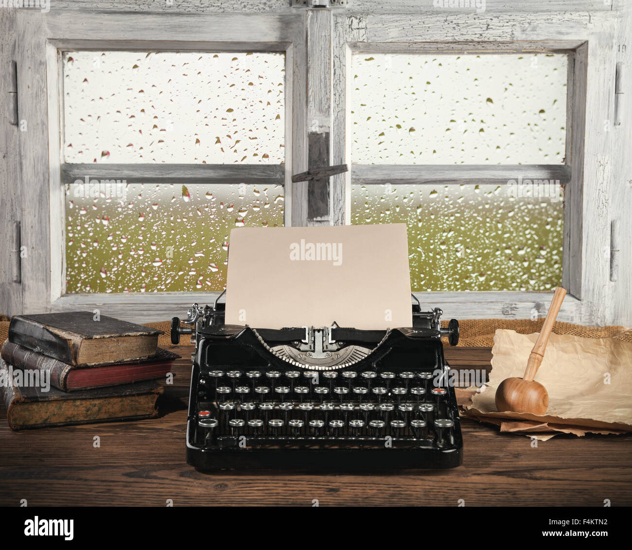 Antique typewriter with old window Stock Photo - Alamy