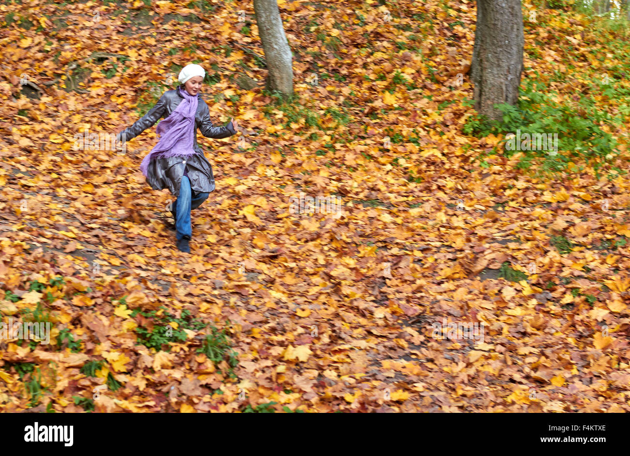girl run in bright yellow autumn forest Stock Photo - Alamy