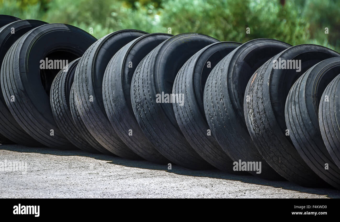 Used old car tires on the street Stock Photo - Alamy