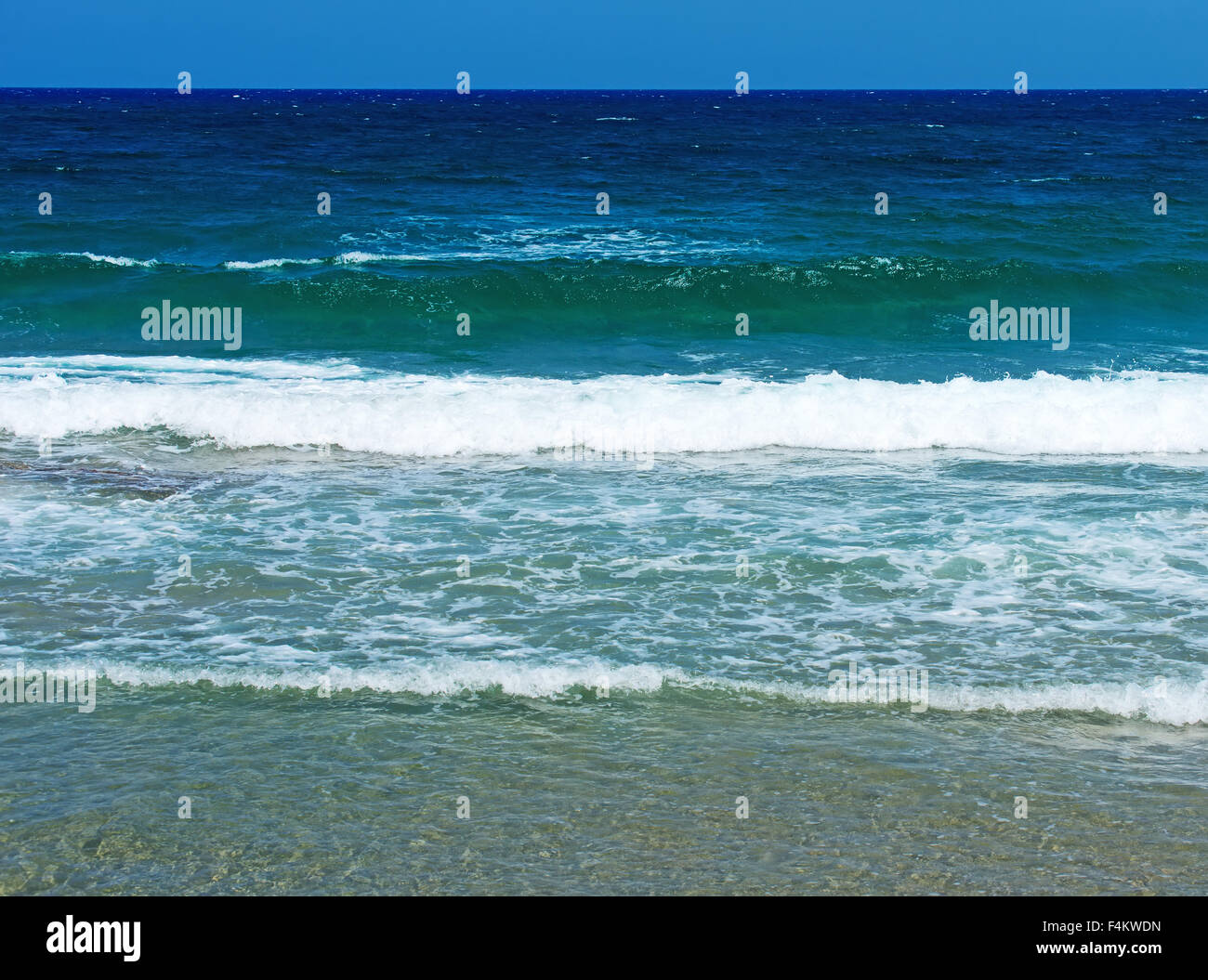 Image of blue waves on the beach Stock Photo - Alamy