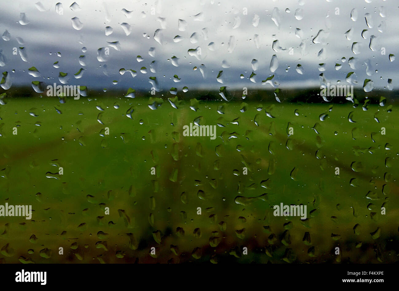 Raindrops on a windows train moving Stock Photo - Alamy