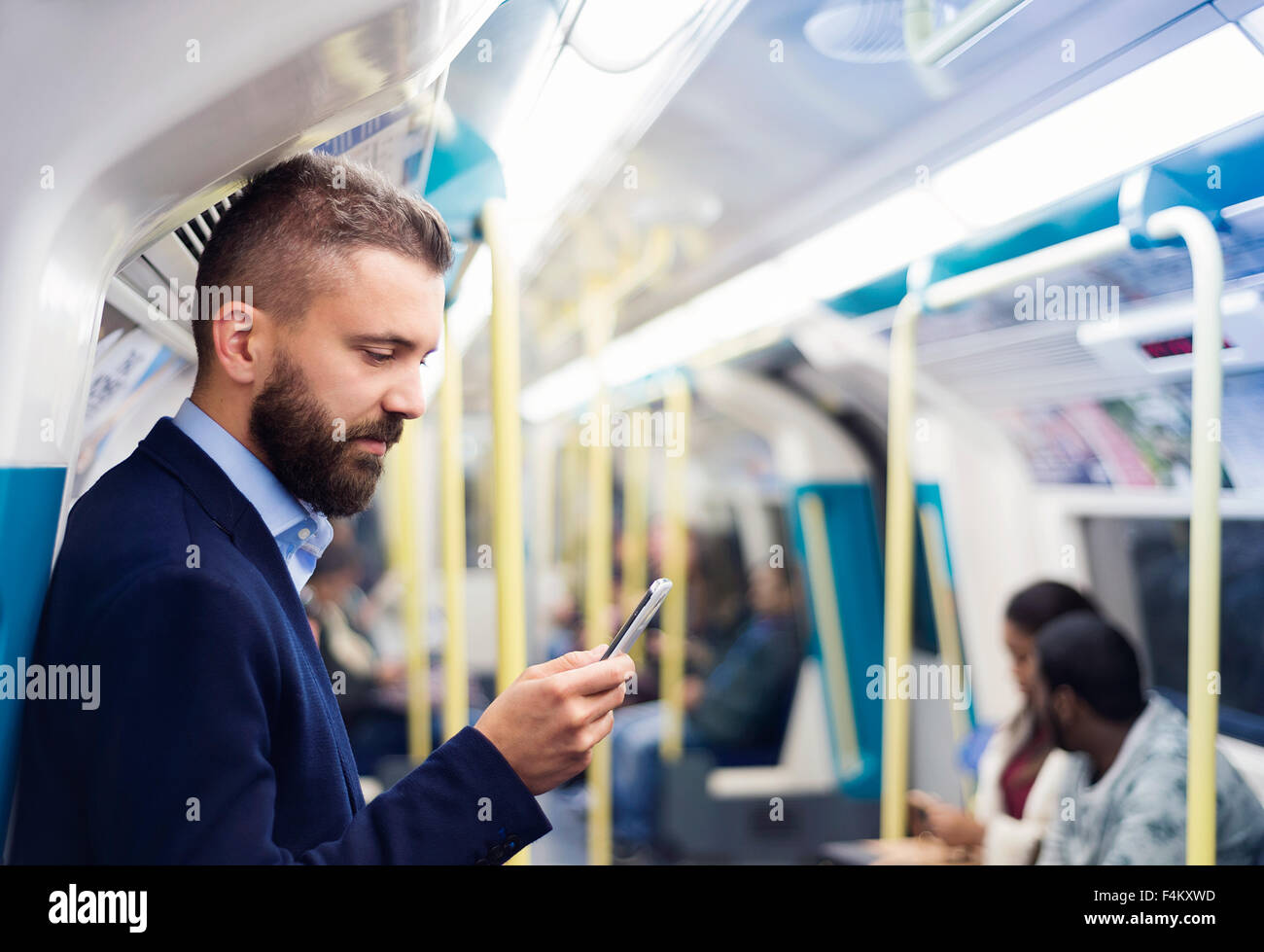 People in subway train with phone hi-res stock photography and images ...