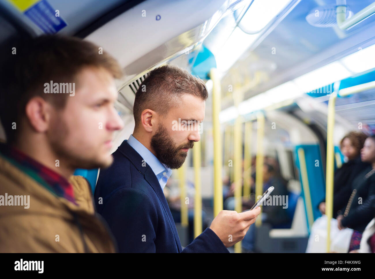 Male texting subway hi-res stock photography and images - Alamy