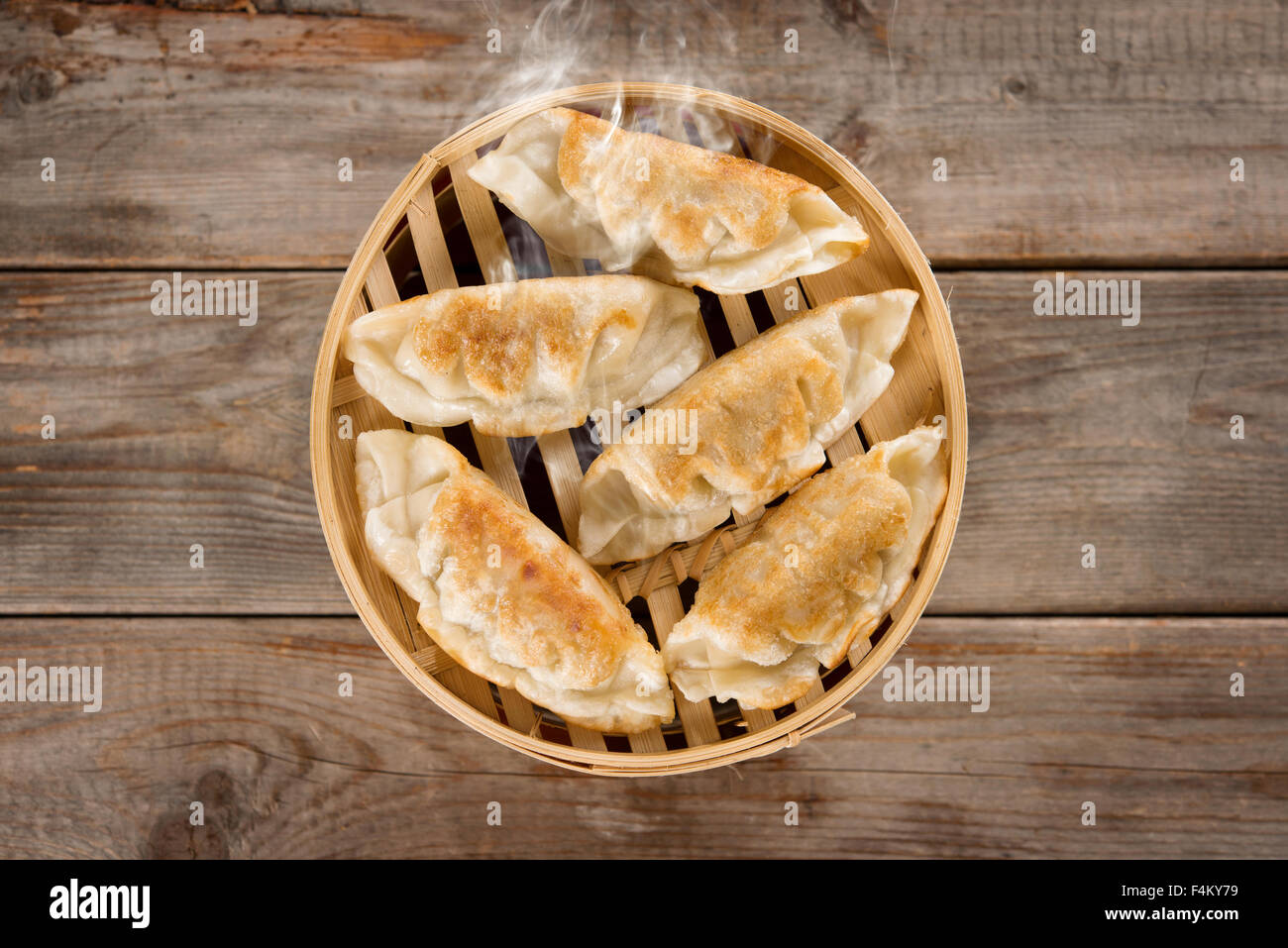 Top view fresh pan fried dumpling on bamboo basket. Chinese food with ...