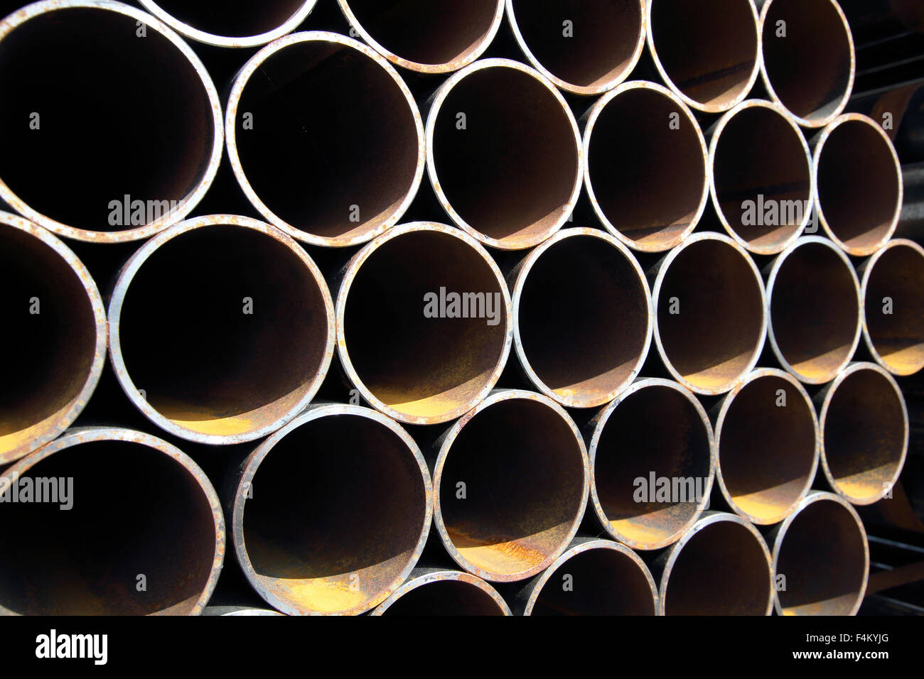 stack of steel pipes industrial background Stock Photo - Alamy