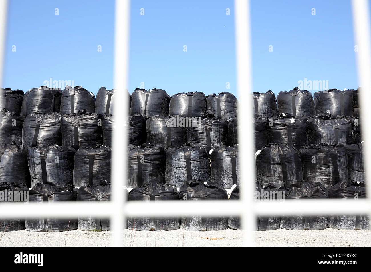 stack of toxic substance bag against a blue sky Stock Photo - Alamy