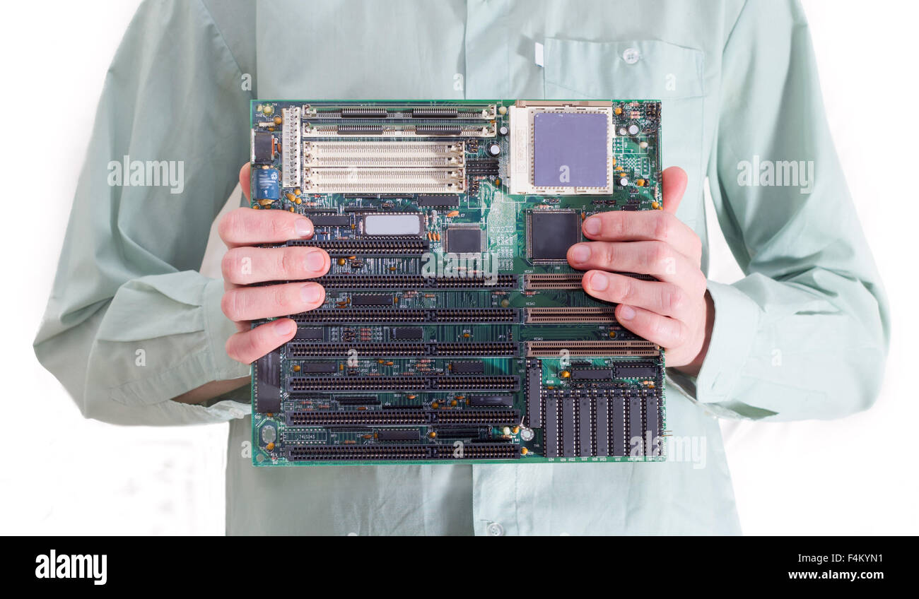 The young man with motherboard in hands on a white background Stock ...