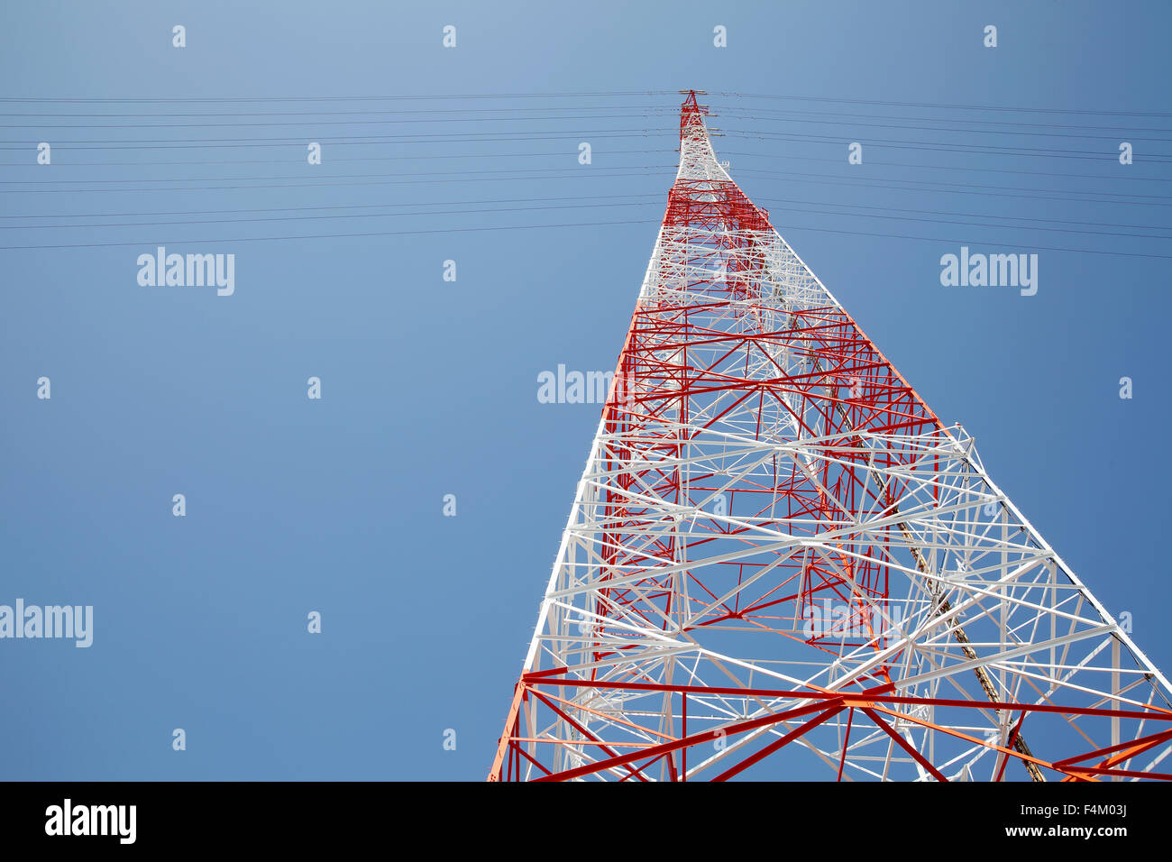 View of electricity pylon and steel cables Stock Photo - Alamy