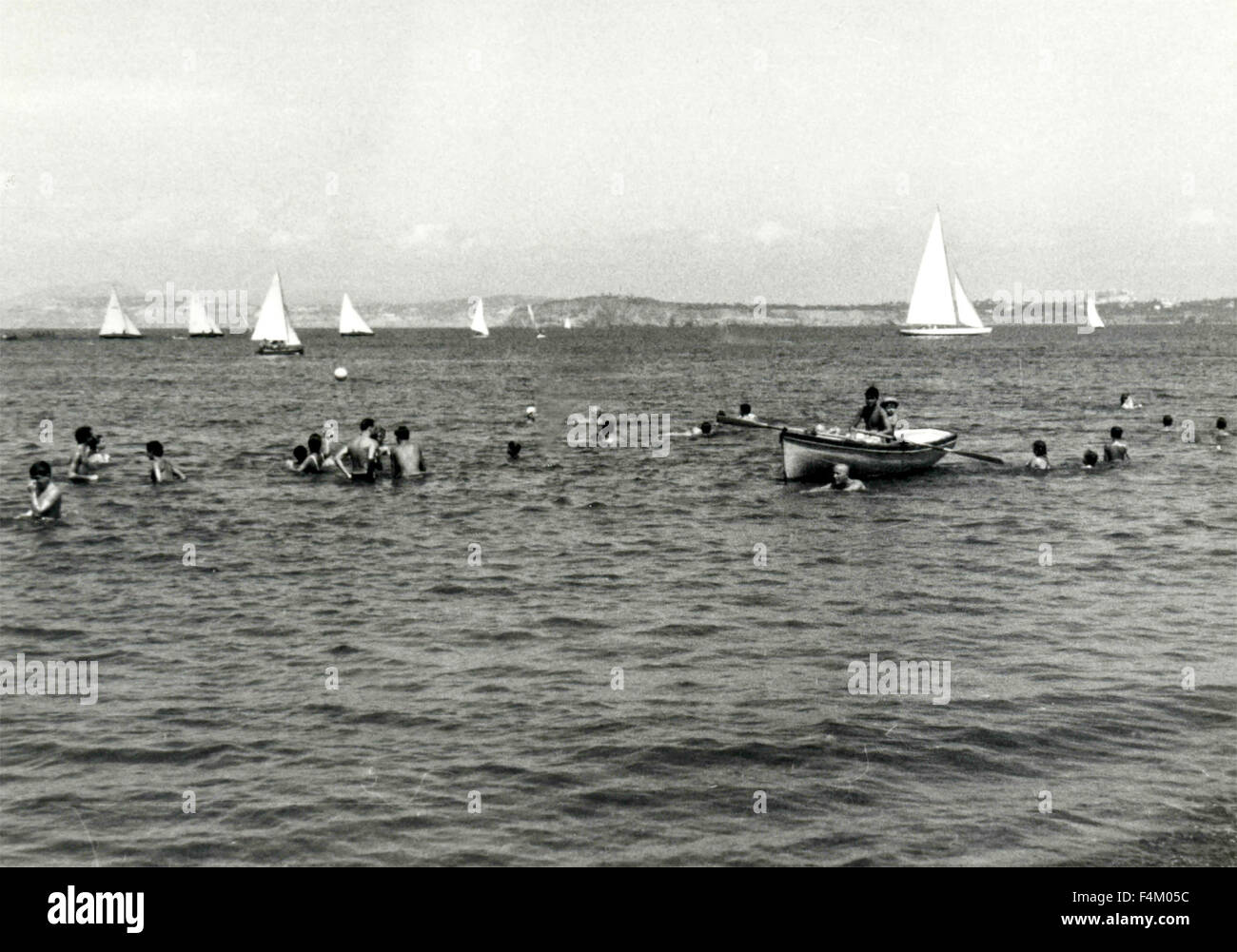 Bathers in the sea, Italy Stock Photo - Alamy