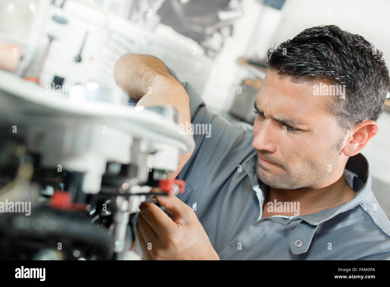 Man using machinery Stock Photo - Alamy