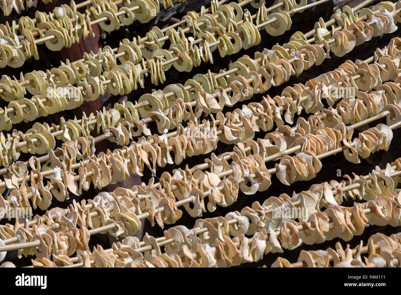 Drying chopped apples in the yard, Marpha village, Mustang, Nepal Stock ...