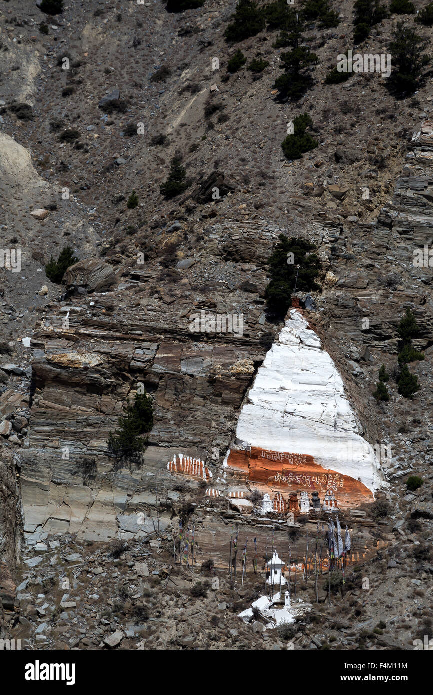 Painted rockface, Marpha, Mustang, Nepal Stock Photo - Alamy