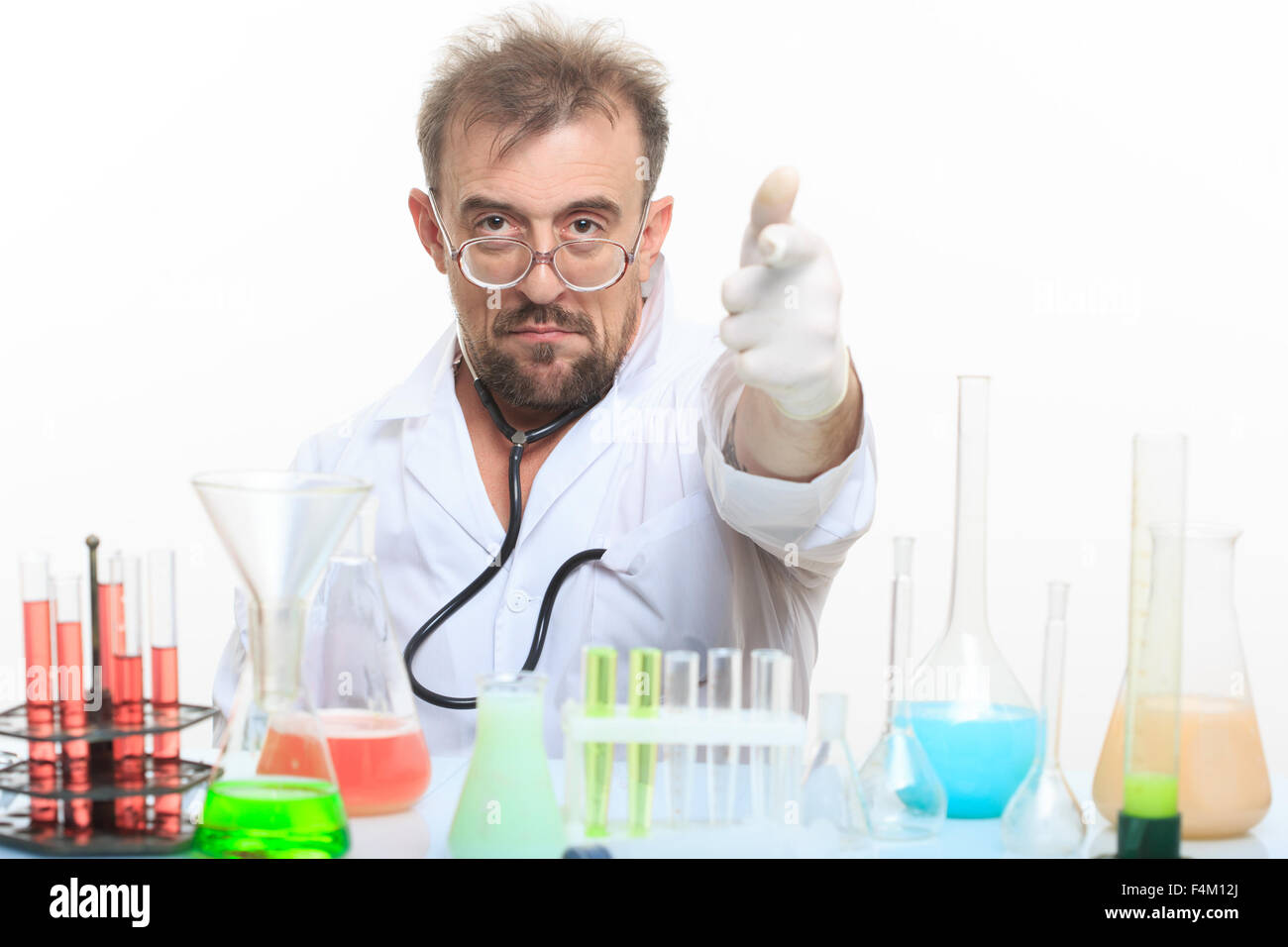 Mad chemist in the lab doing reaction Stock Photo - Alamy