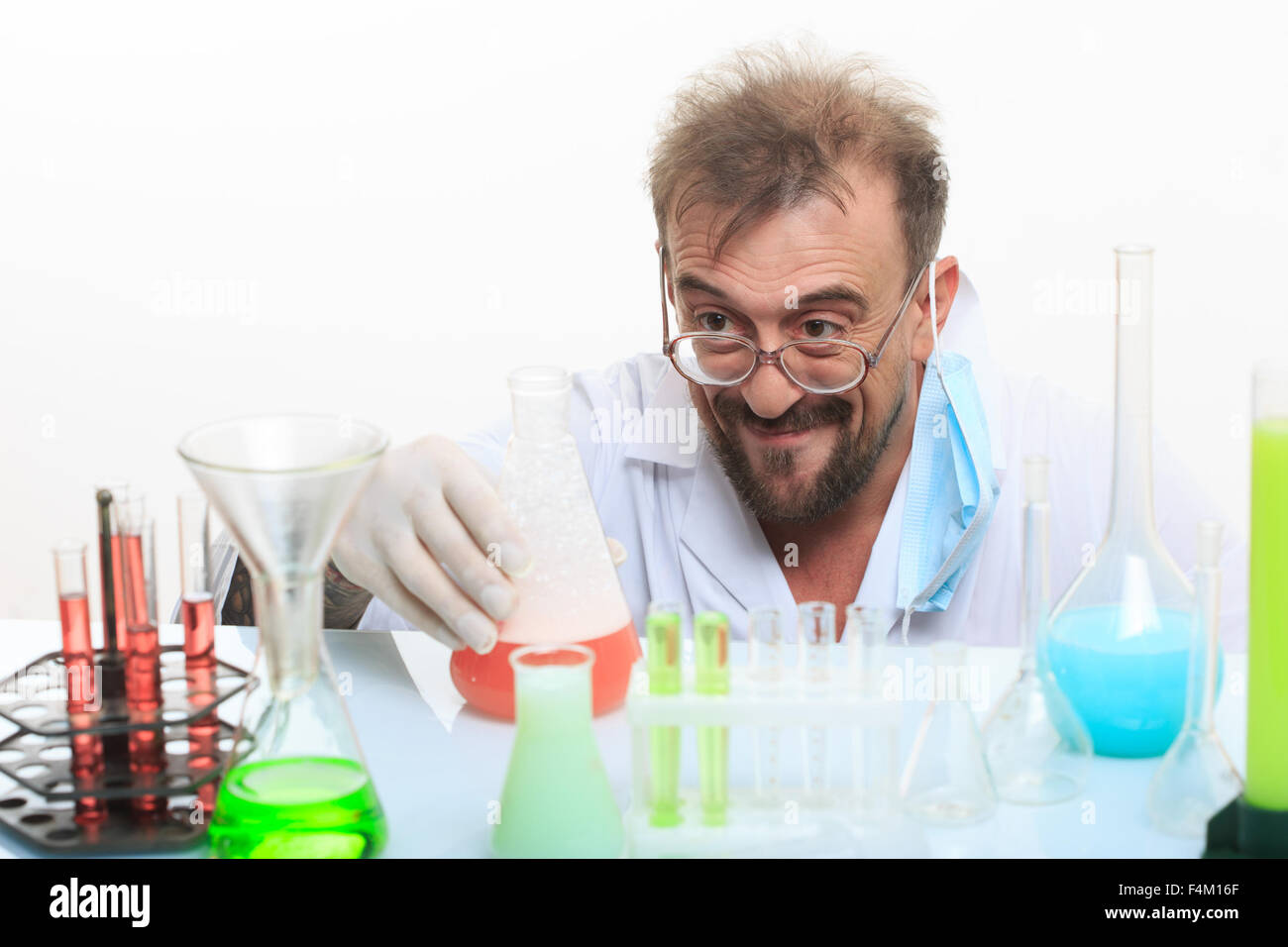 Mad chemist in the lab doing reaction Stock Photo - Alamy