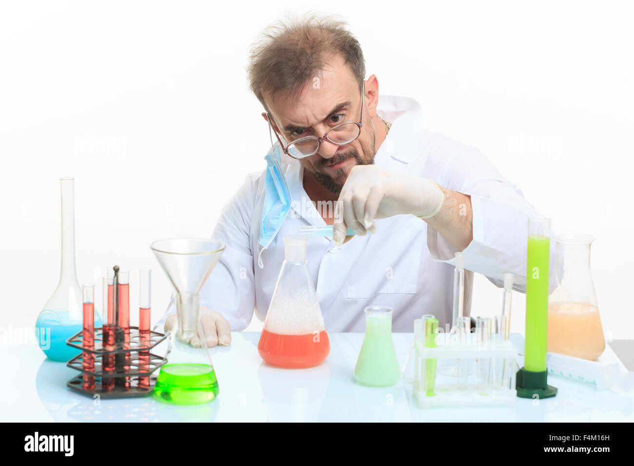 Mad chemist in the lab doing reaction Stock Photo - Alamy