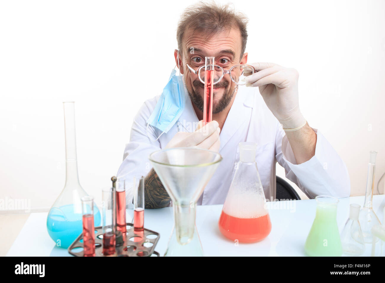 Mad chemist in the lab doing reaction Stock Photo - Alamy