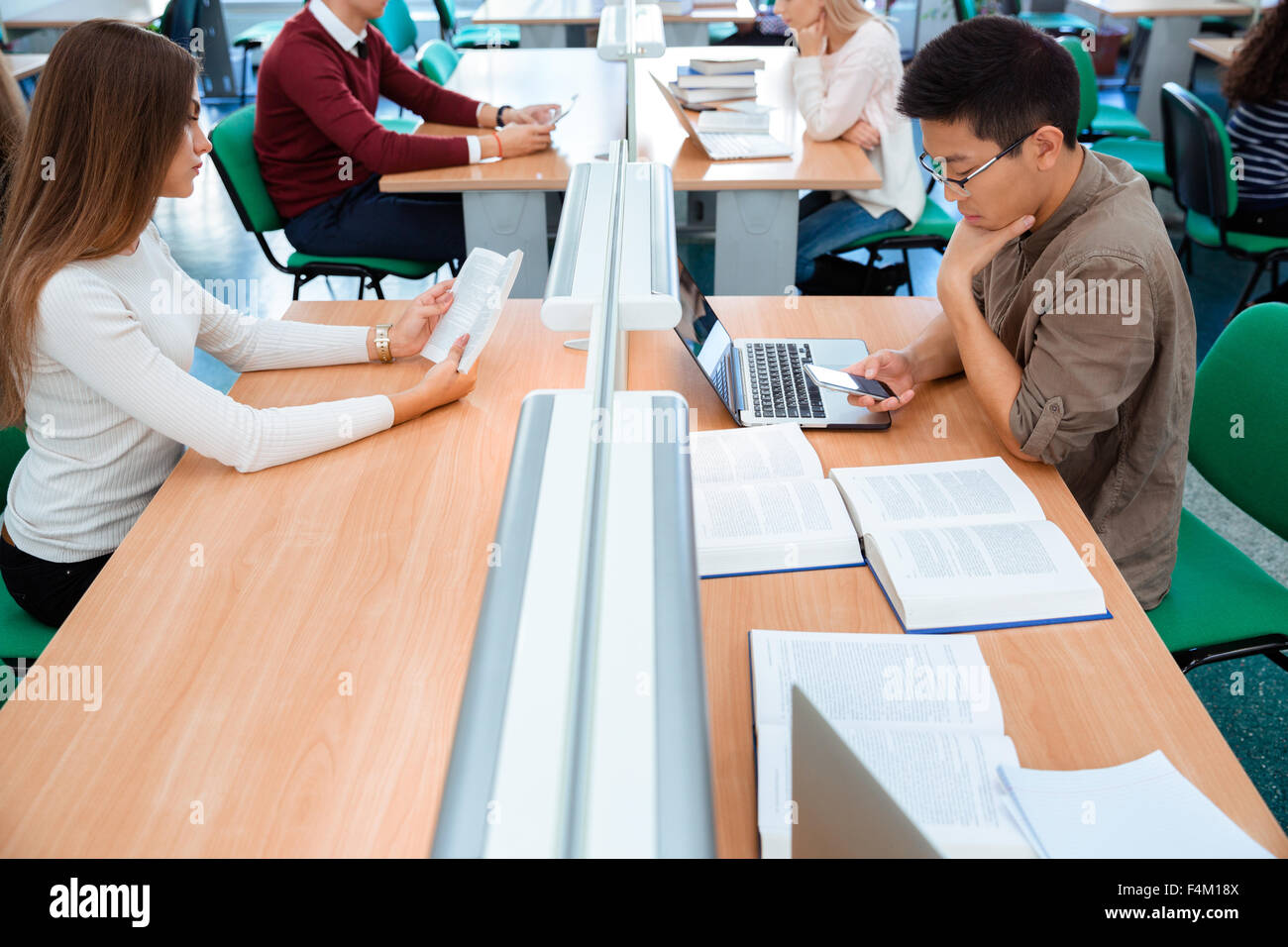 High school students reading library hi-res stock photography and ...